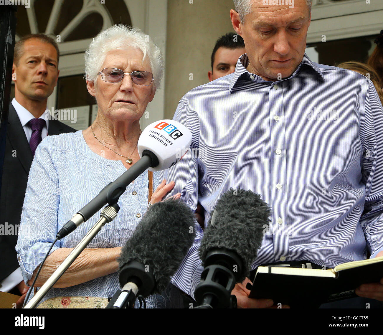 Maureen Lock (left) widow of Donald Lock, listens as her son Andrew ...