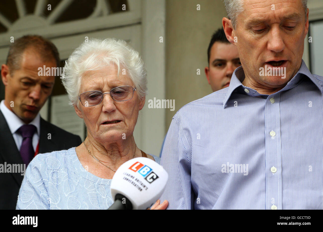 Maureen Lock (left) widow of Donald Lock, listens as her son Andrew ...