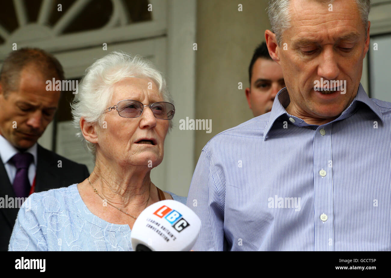 Maureen Lock (left) widow of Donald Lock, listens as her son Andrew ...