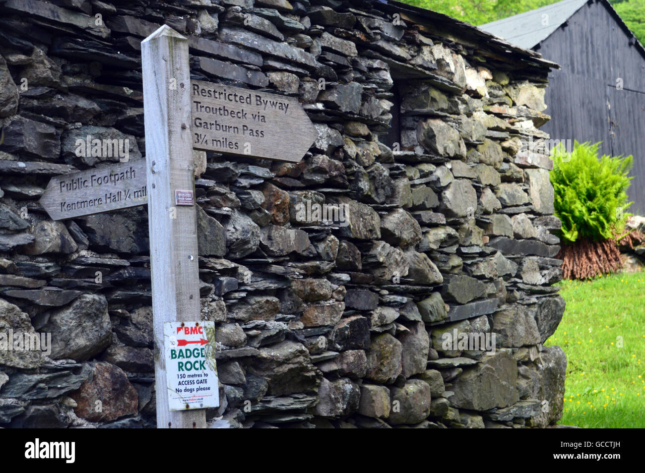 Wooden Signpost in Kentmere Village for the Garburn Pass to Troutbeck ...