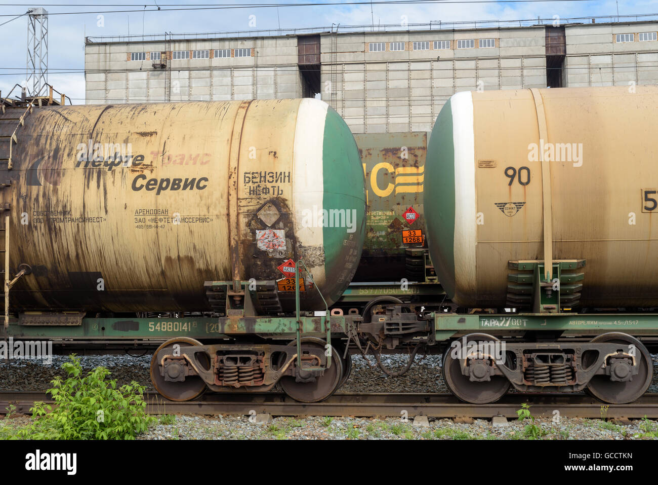 Cargo train carrying containers for gas and fuel Stock Photo - Alamy