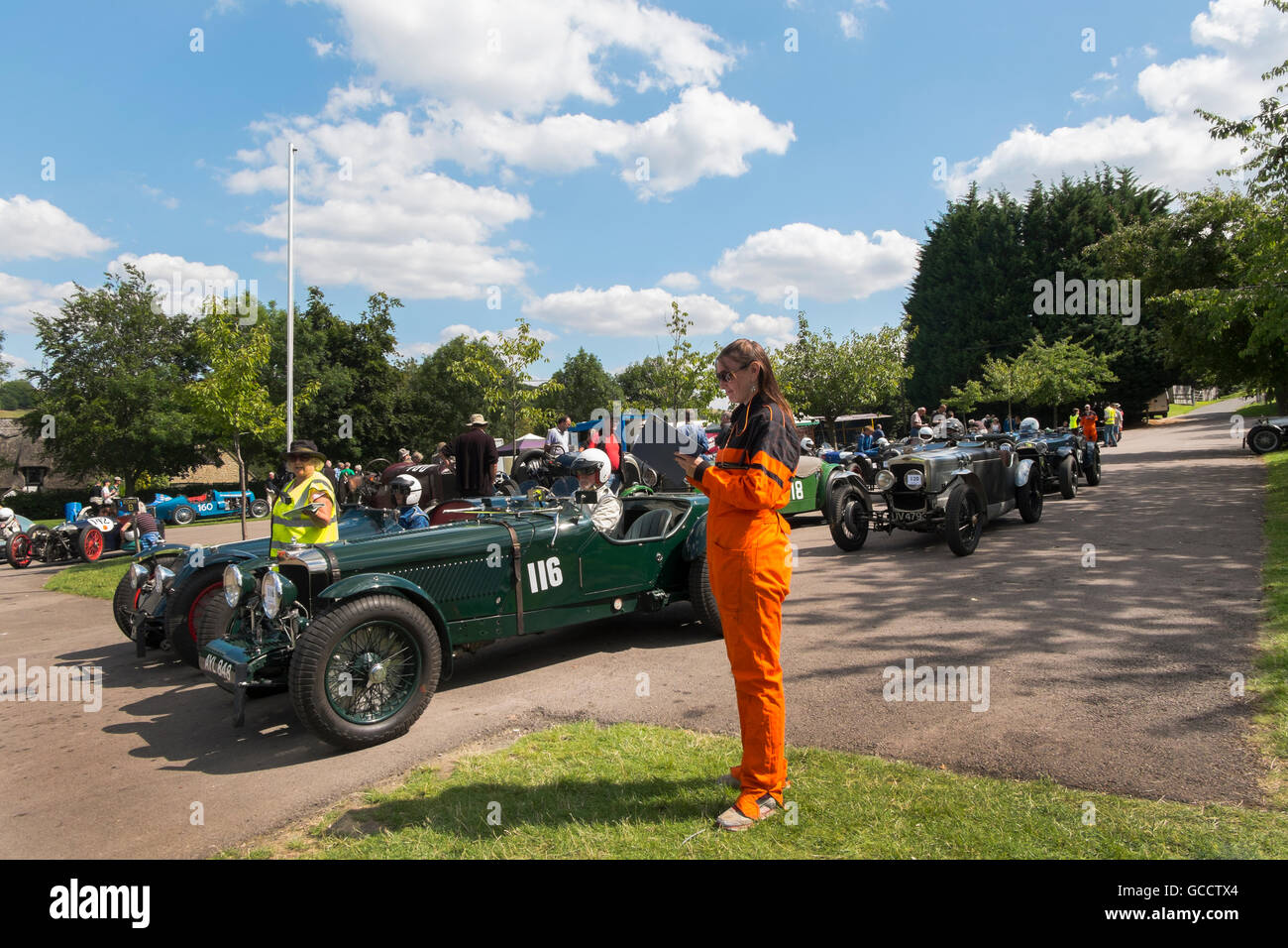Female marshall directing cars at the VSCC event at Prescott Hill Climb ...