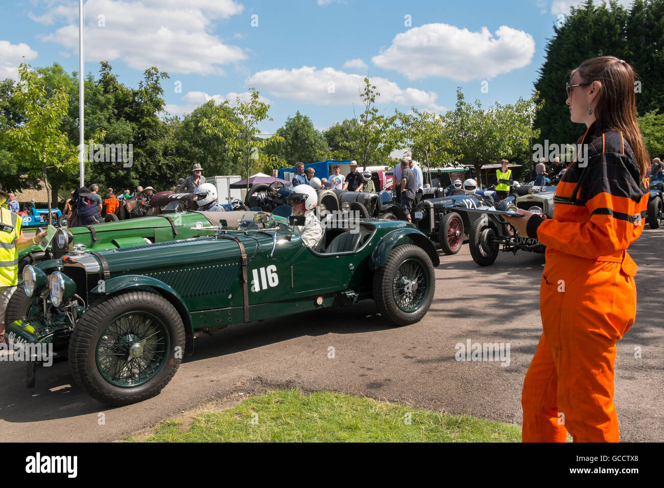 Female marshall directing cars at the VSCC event at Prescott Hill Climb ...