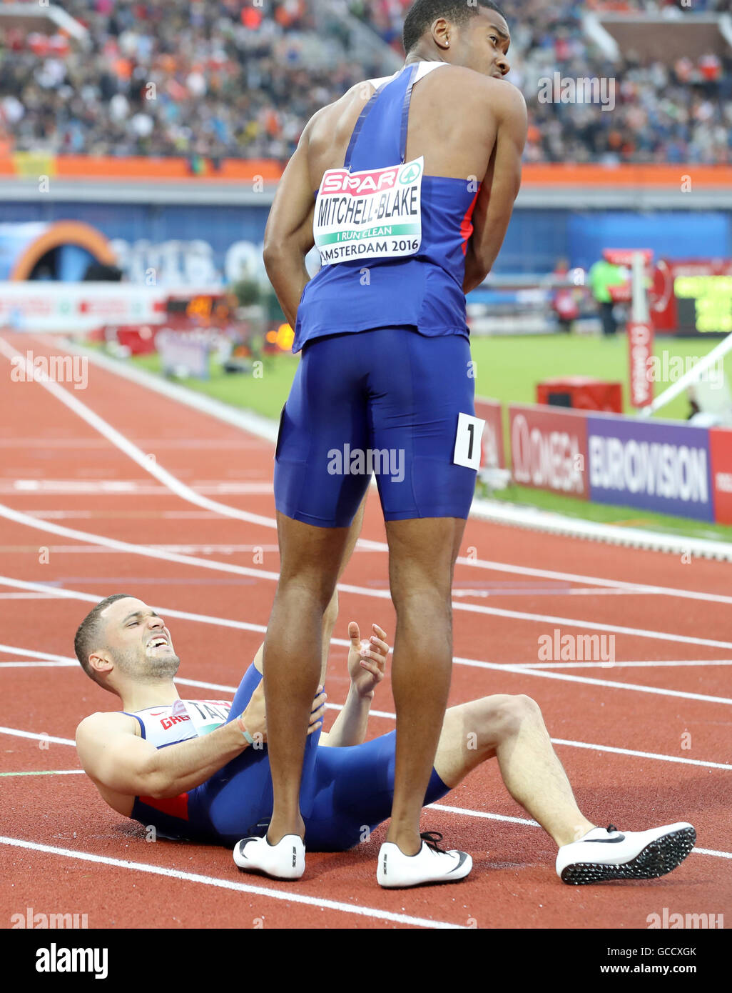 Great Britain's Nethaneel Mitchell-Blake helps compatriot Danny Talbot ...