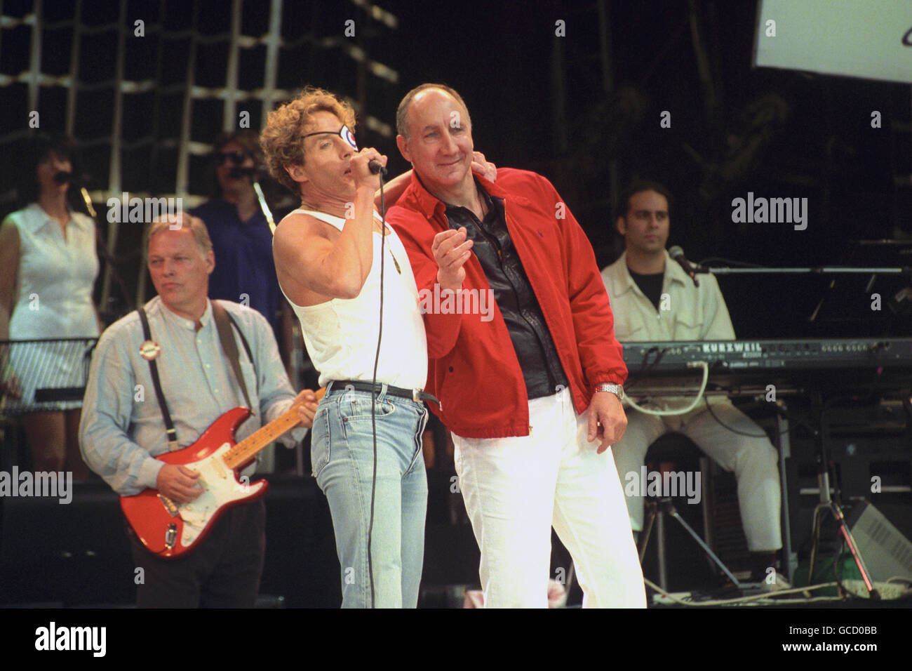 The Who's Roger Daltrey (L) dons an eye patch covering his injured eye ...