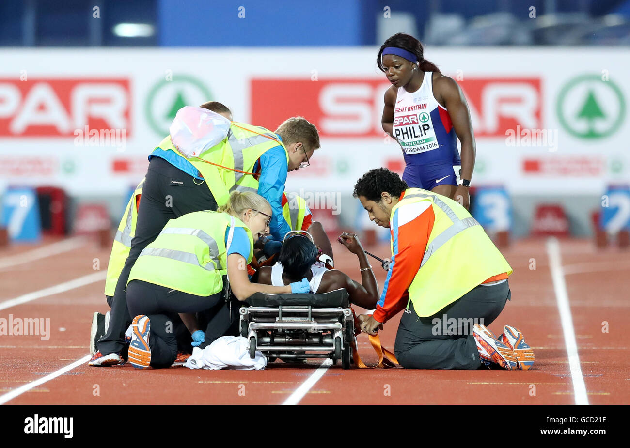 Great Britain's Desiree Henry receives medical attention after not ...