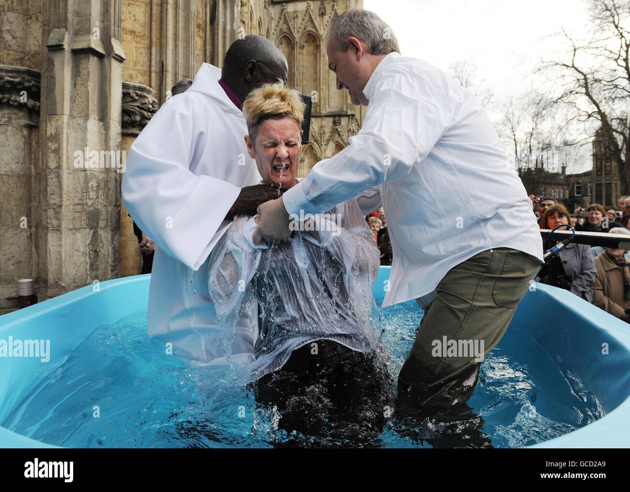 The Archbishop of York, Dr John Sentamu (left), baptises Linda Johnson ...