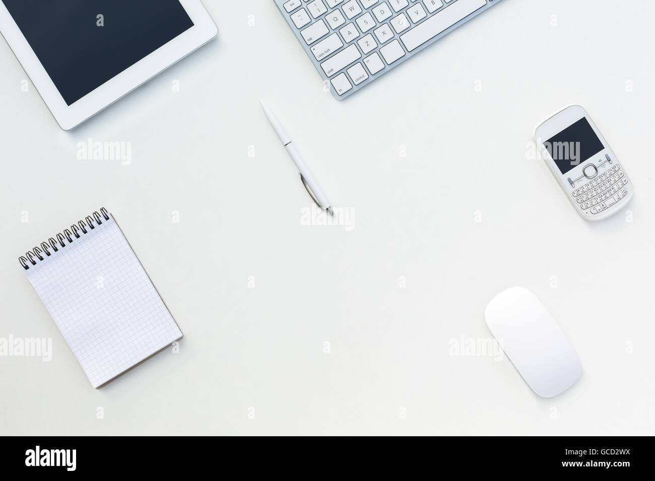 White Office Desk Table with Computer Keyboard and Other Gadgets and ...