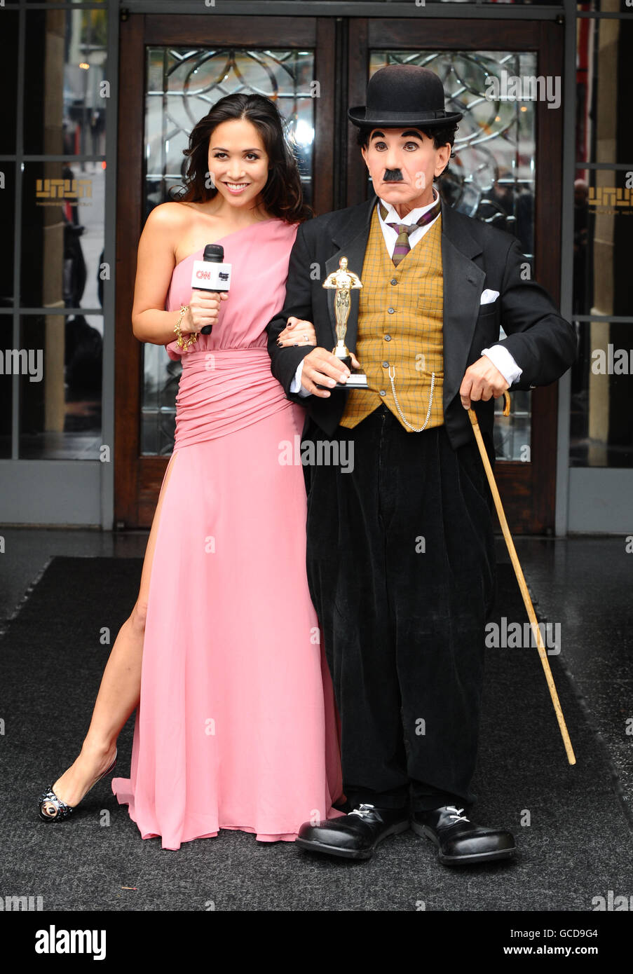 Myleene Klass is seen next to a Charlie Chaplin impersonator at a ...