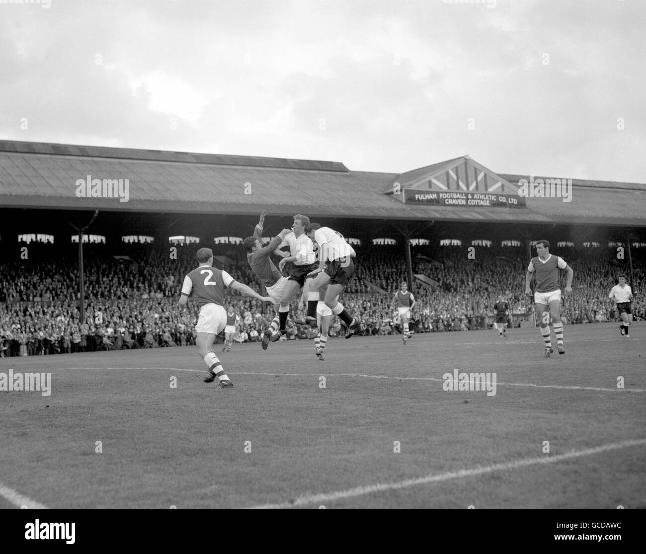Fulham's Stan Brown (centre) and Bobby Robson, fourth left, challenge ...