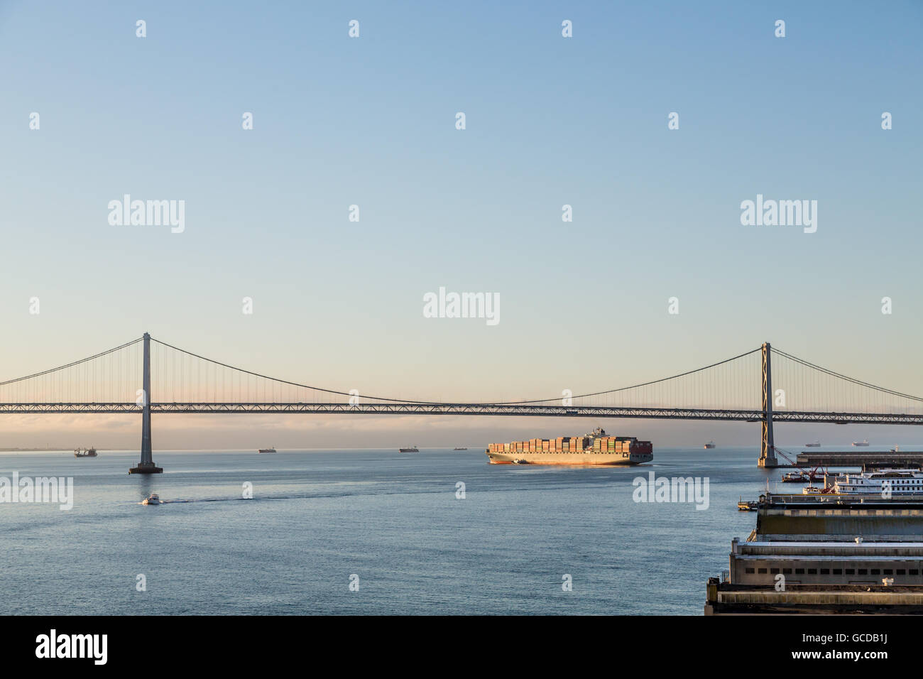 Freighter Under Bay Bridge Stock Photo - Alamy