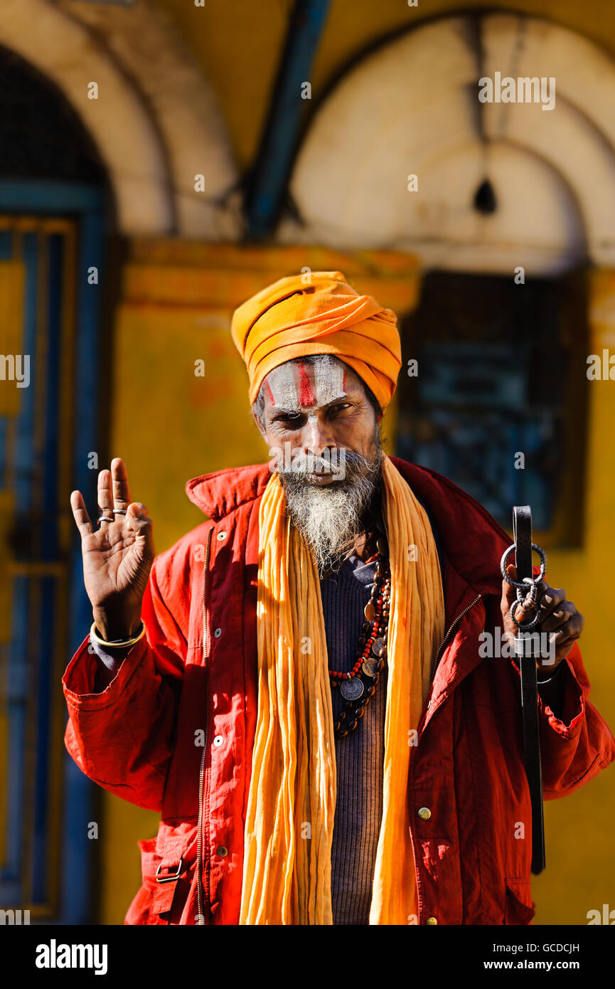 Holy Hindu monk greeting with three finger sign in Pashupatinath ...