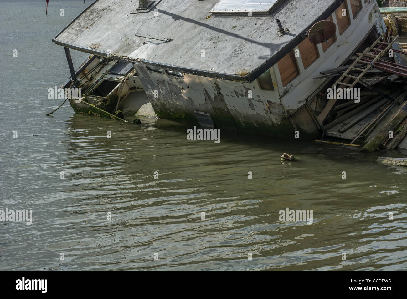 Sinking ship / failing business concept, represented by waterlogged ...
