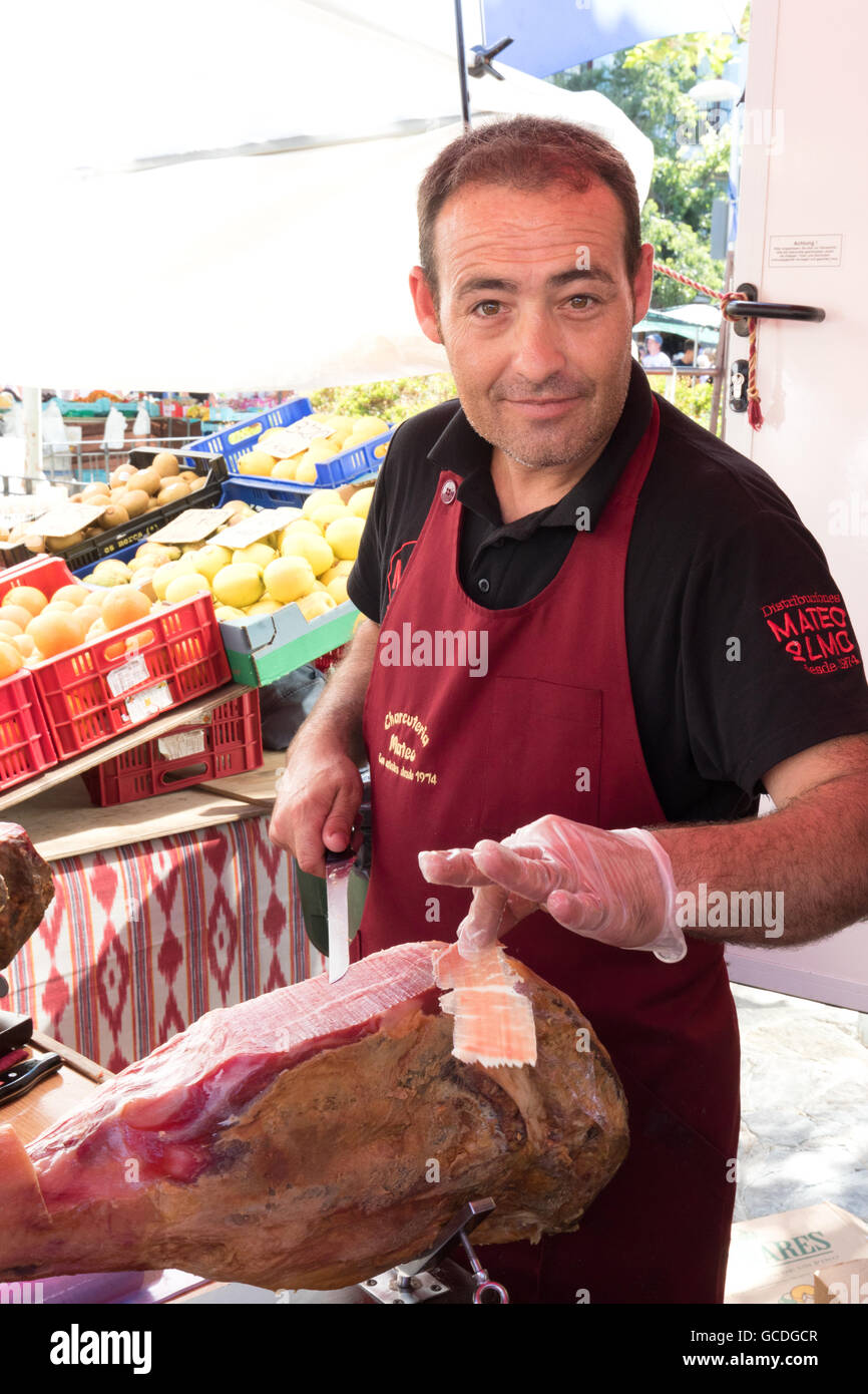 market stall trader carving a ham ( Jamon ), Pollensa ( Pollenca ...