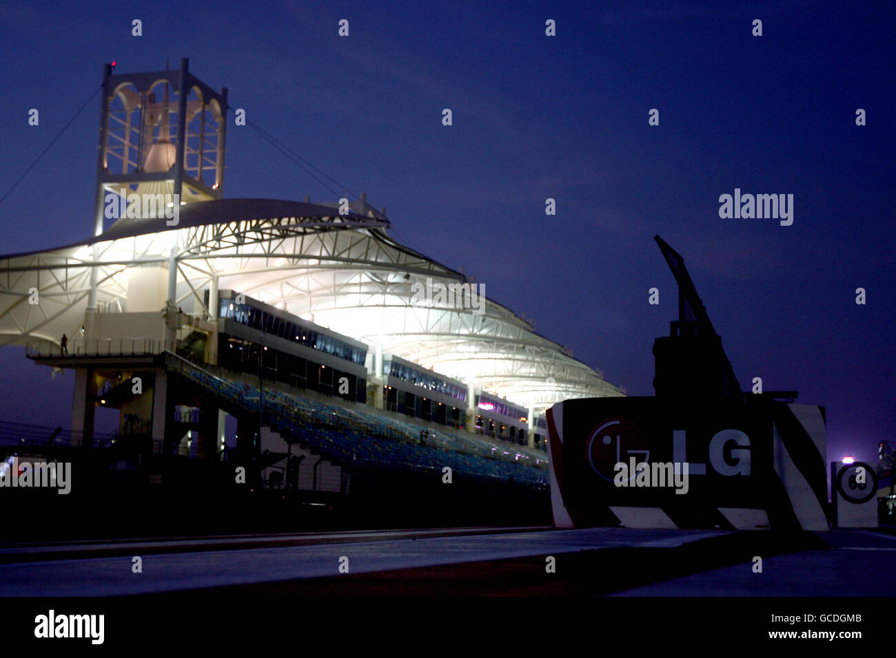 A general view of the starting straight and pit entrance at night ...