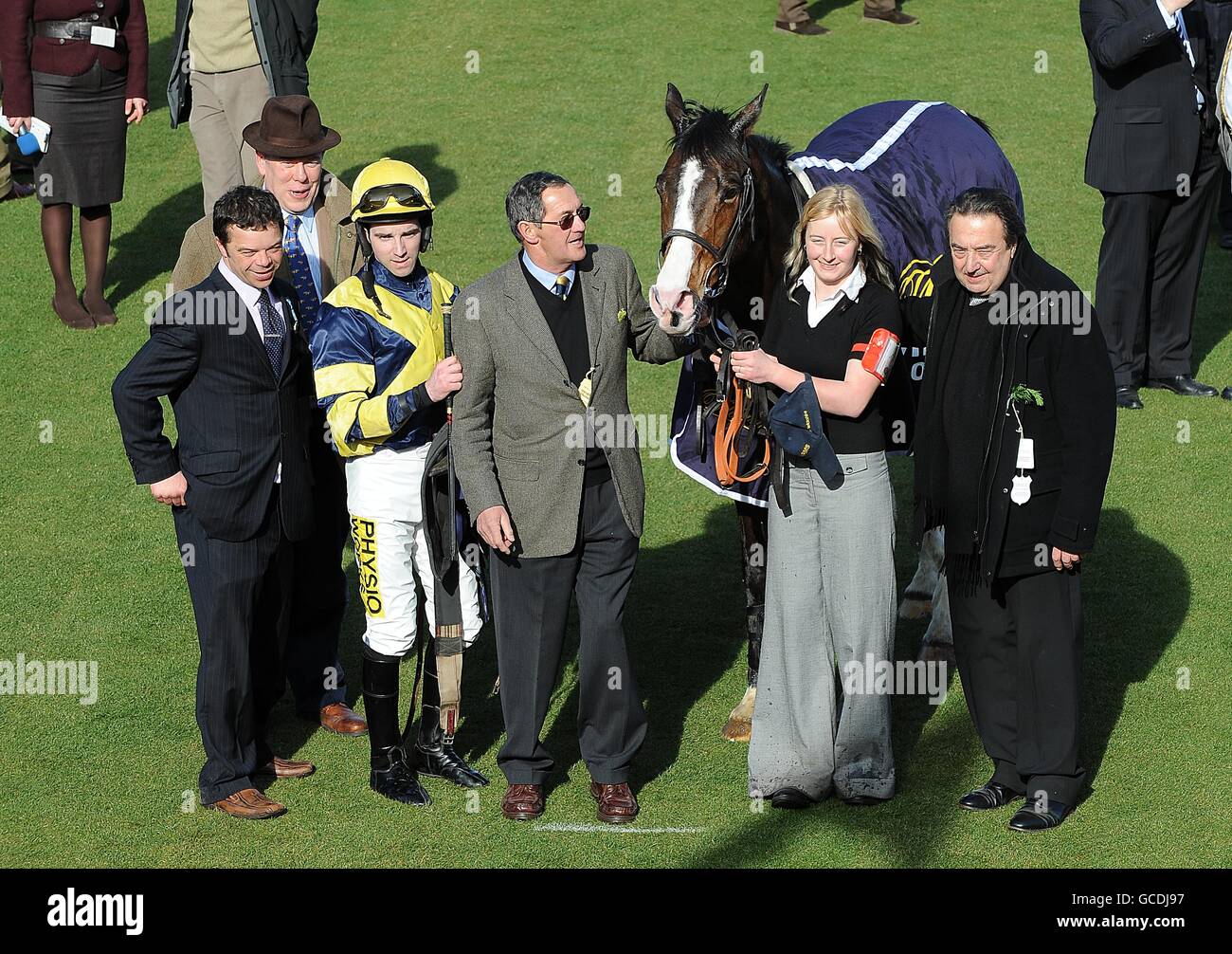Jockey Paddy Aspell celebrates after winning the William Hill Trophy ...