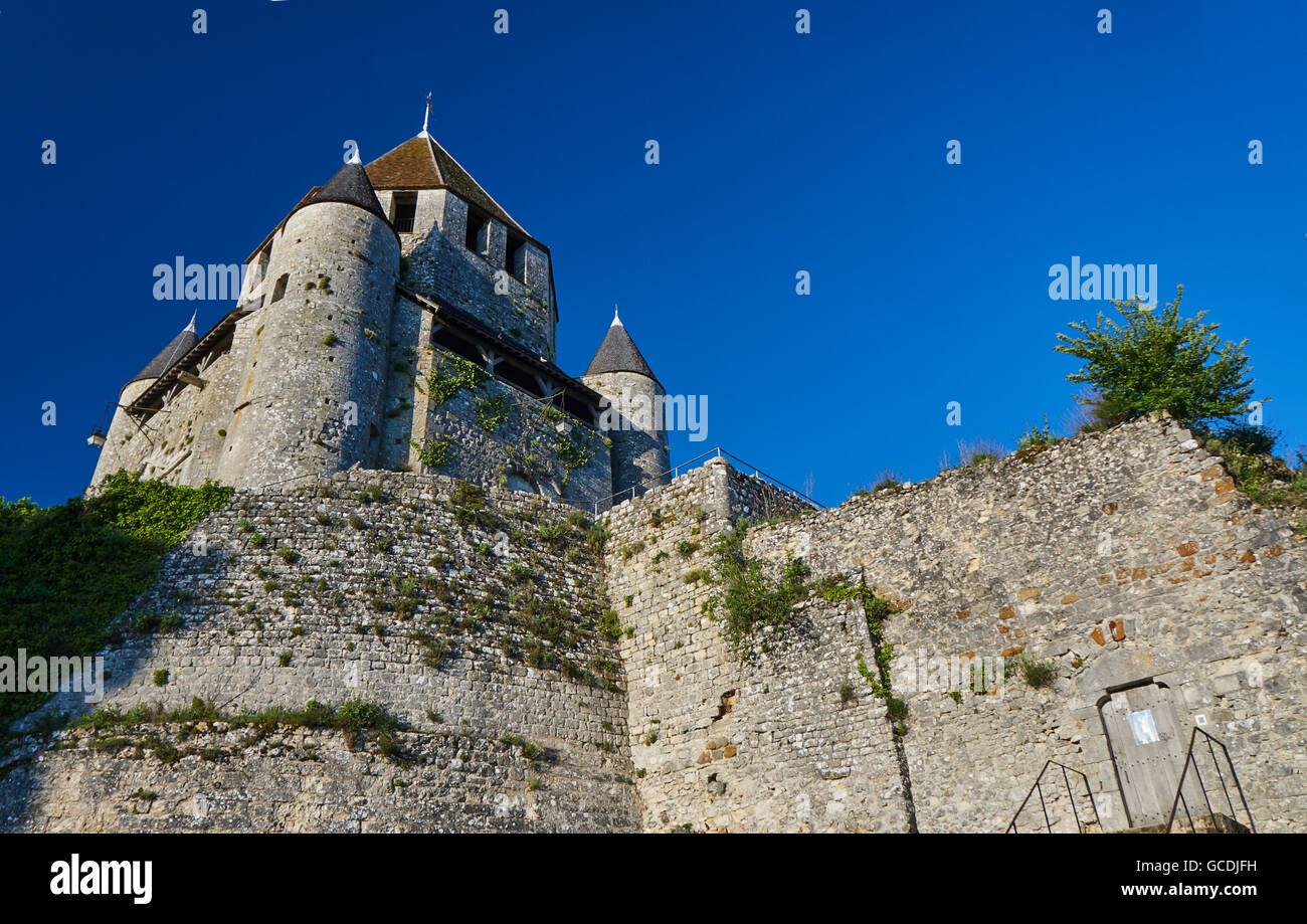 Stone walls and towers of a medieval castle in the town of Provins ...