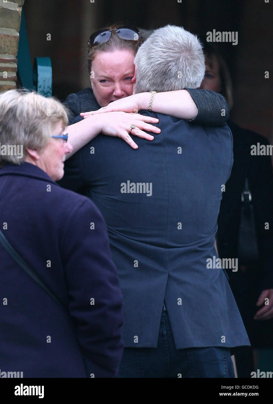 Paul Donnison, father of Harry and Elsie Donnison is comforted by ...
