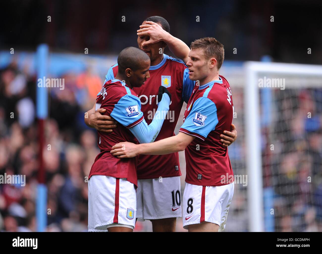 Aston Villa's John Carew (centre) celebrates with teammates Ashley ...