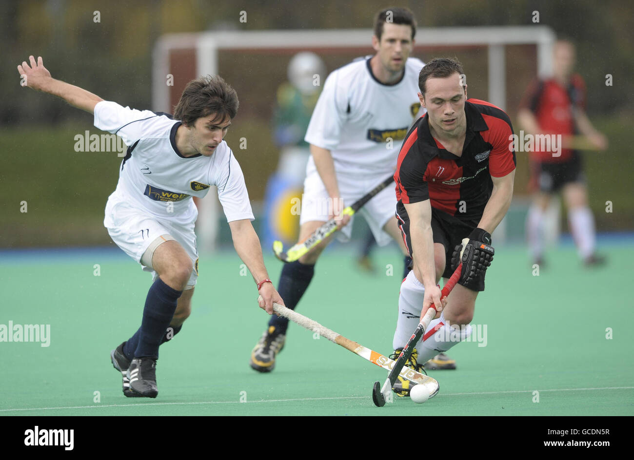 Beeston's Adam Dixon (left) challenges with Bowdon's Ian Wilson during ...