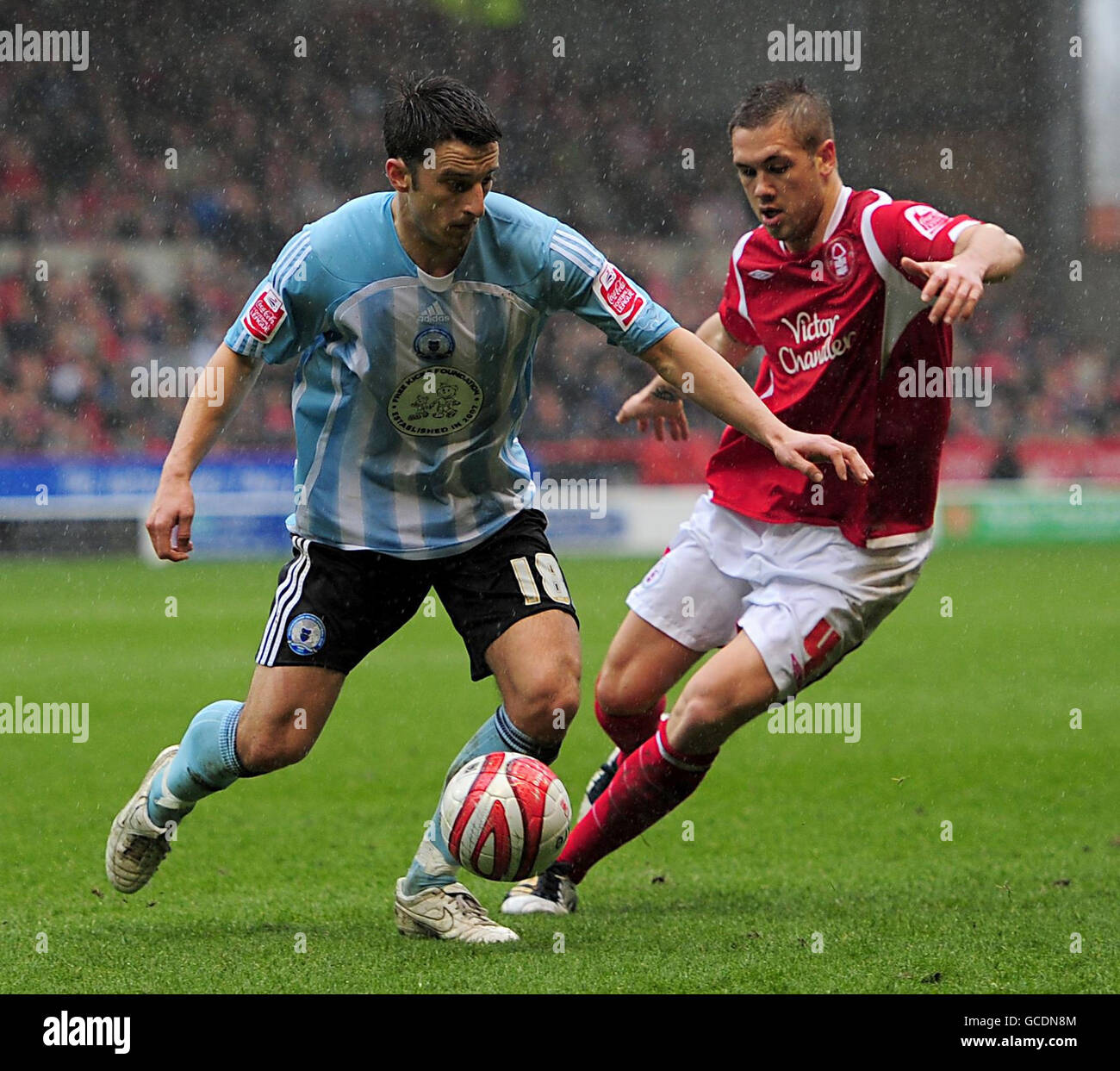 Nottingham Forest's Luke Chambers and Peterborough United's Chris ...