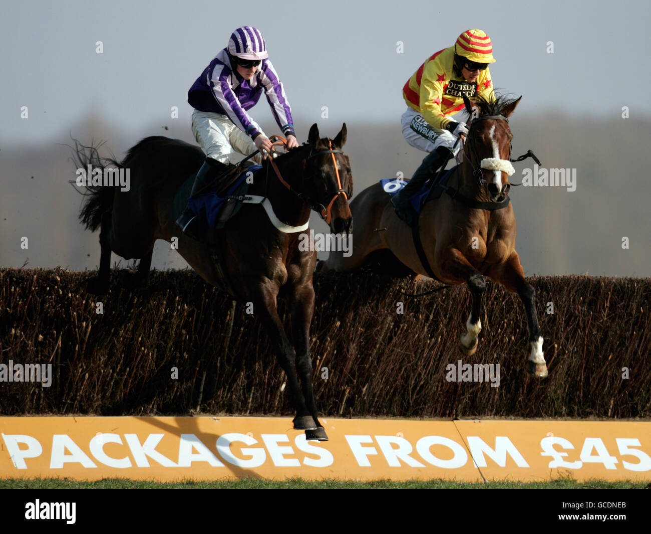 Jockey Giles Hawkins on Mister Quasimodo (left) jumpos ahead of Felix ...