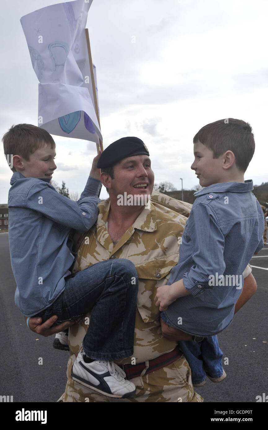 Staff Sergeant Mark Eastley with his two sons Ryan, eight, (left) and ...