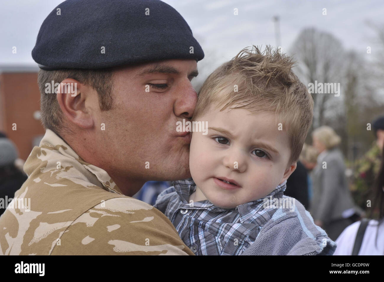 Lance Corporal Rob Forsyth kisses his son Robson, as troops of 26 ...