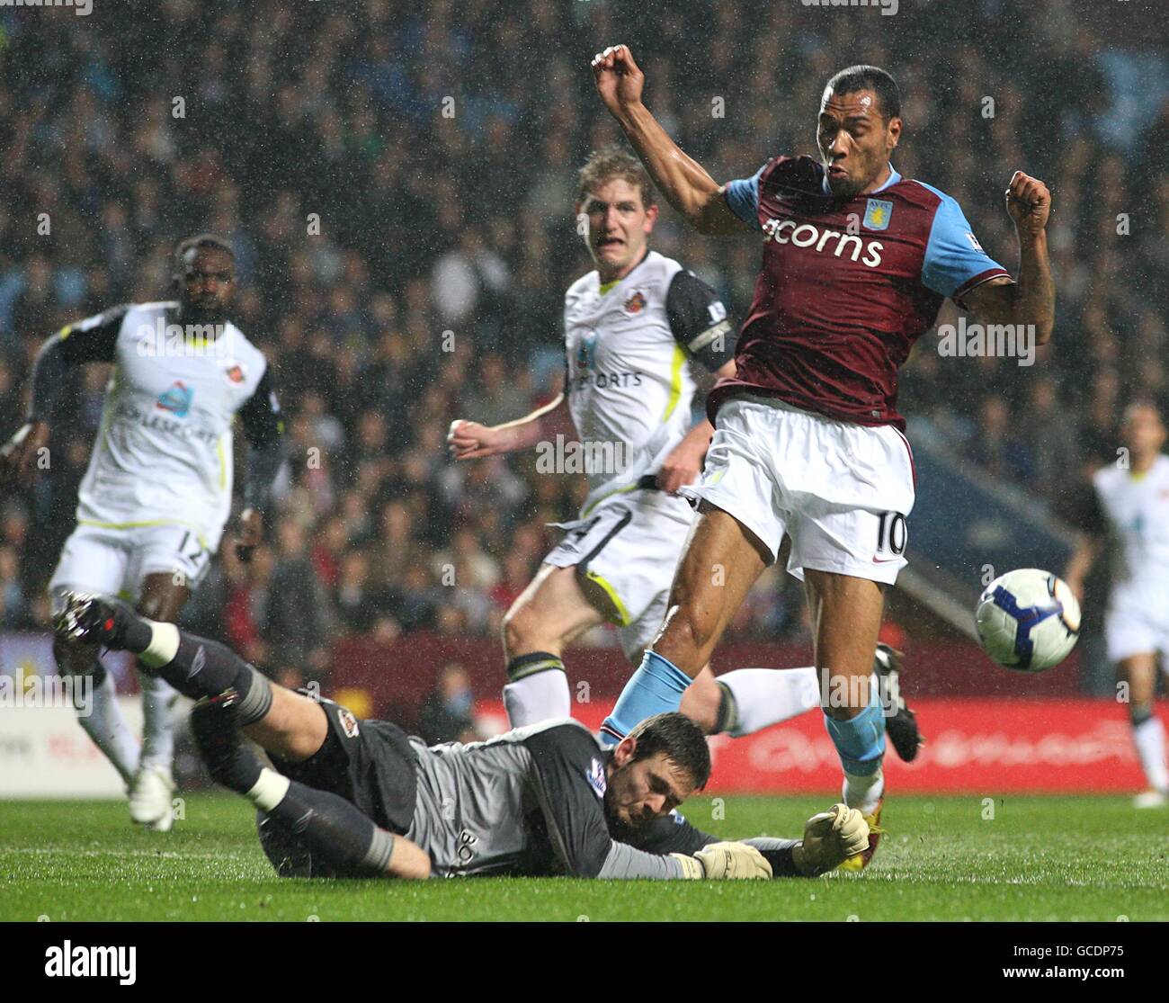 Sunderland goalkeeper Craig Gordon (left) makes a save after Aston ...