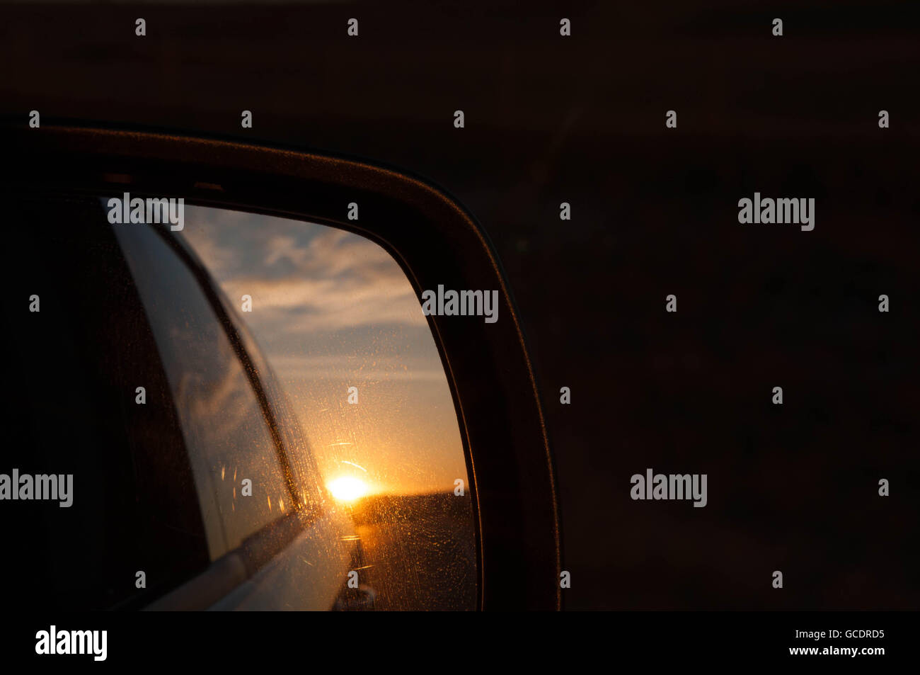 sunset reflection from the car mirror Stock Photo - Alamy