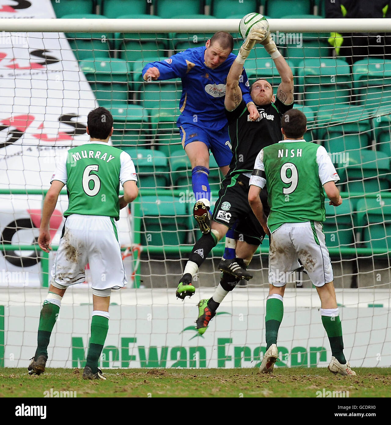 Hibernian goalkeeper Graham Stack claims the ball in the air Stock ...