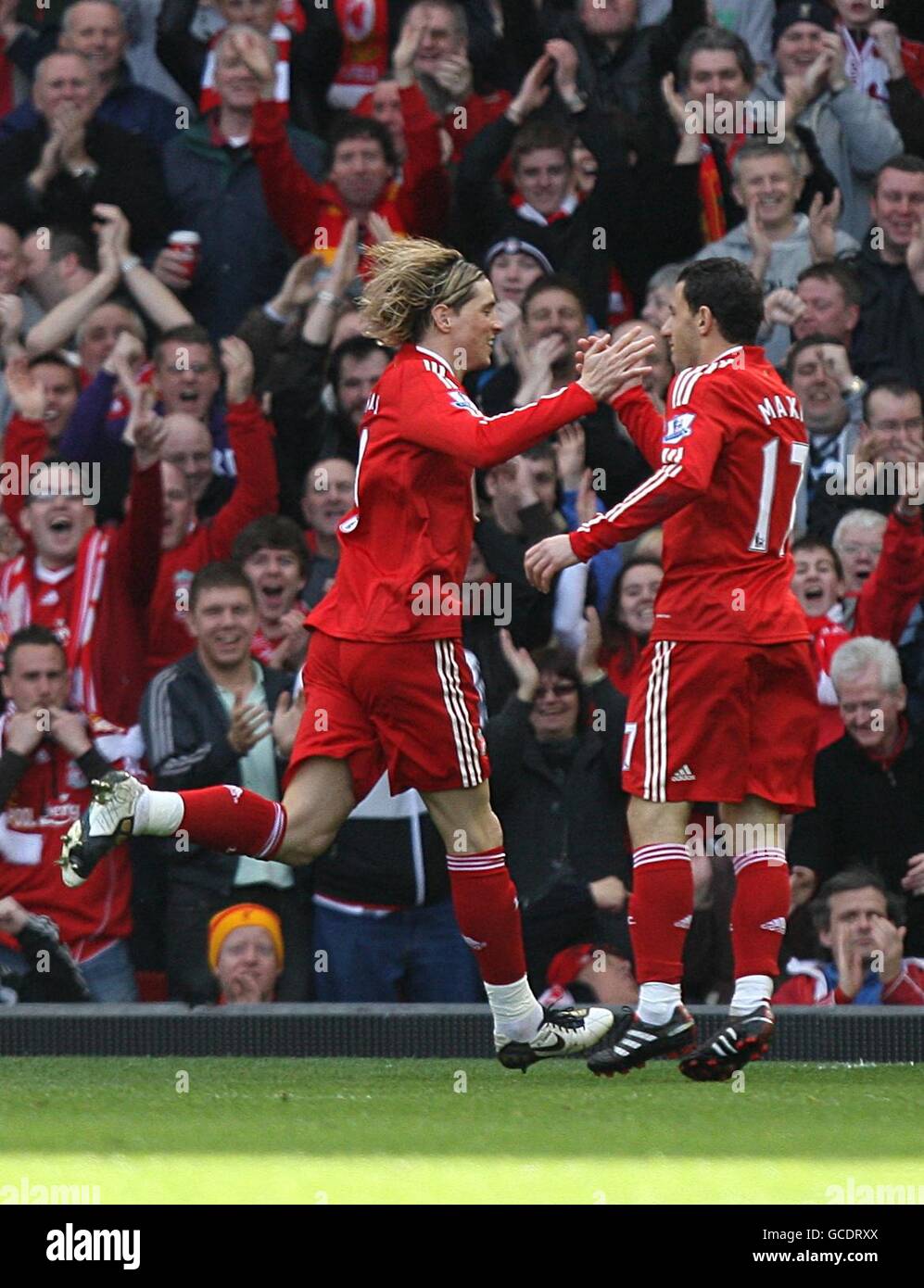 Liverpool's Fernando Torres (left) celebrates after scoring the first ...