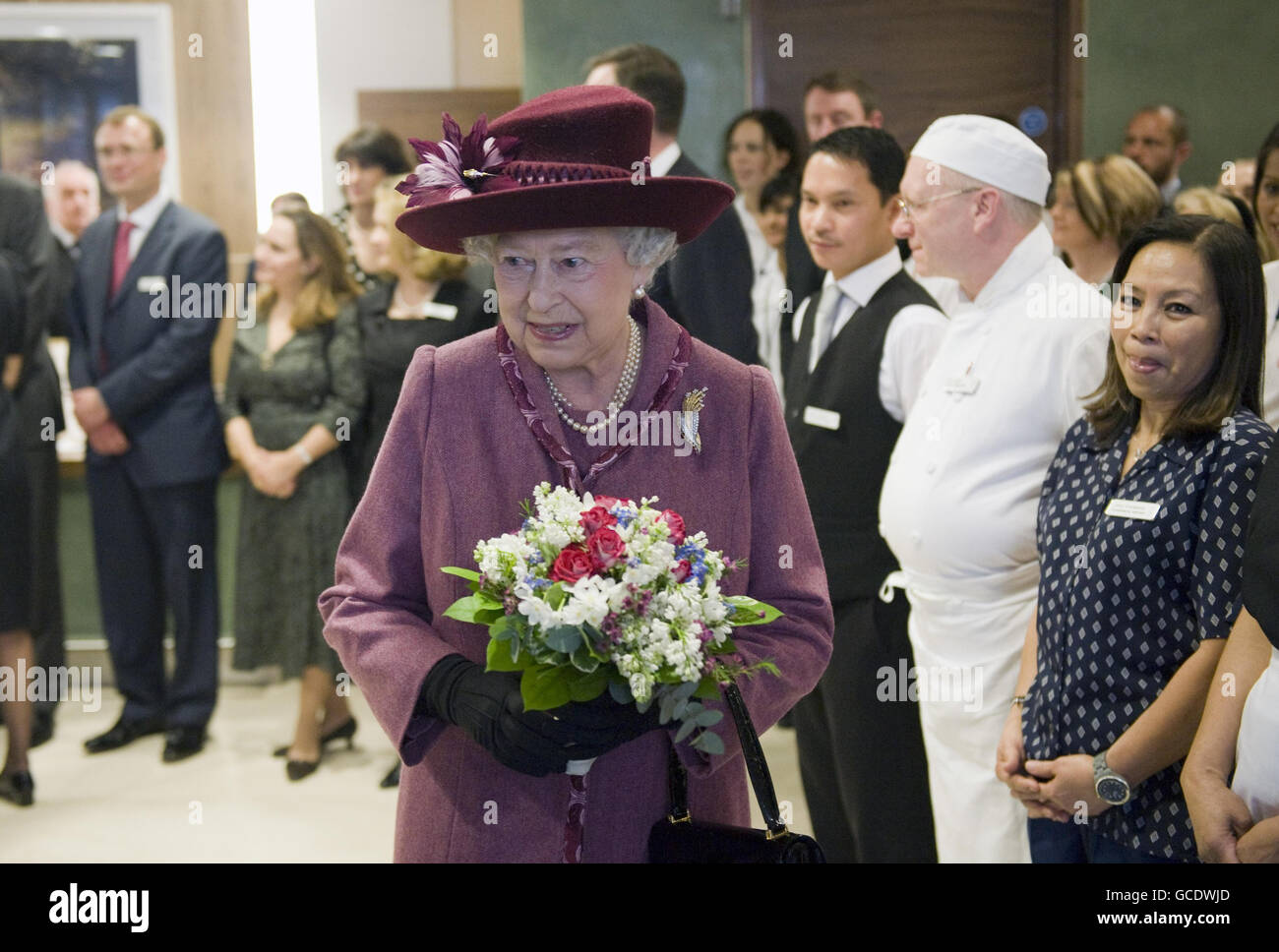Britain's Queen Elizabeth II meets staff as she opened the new 80 ...