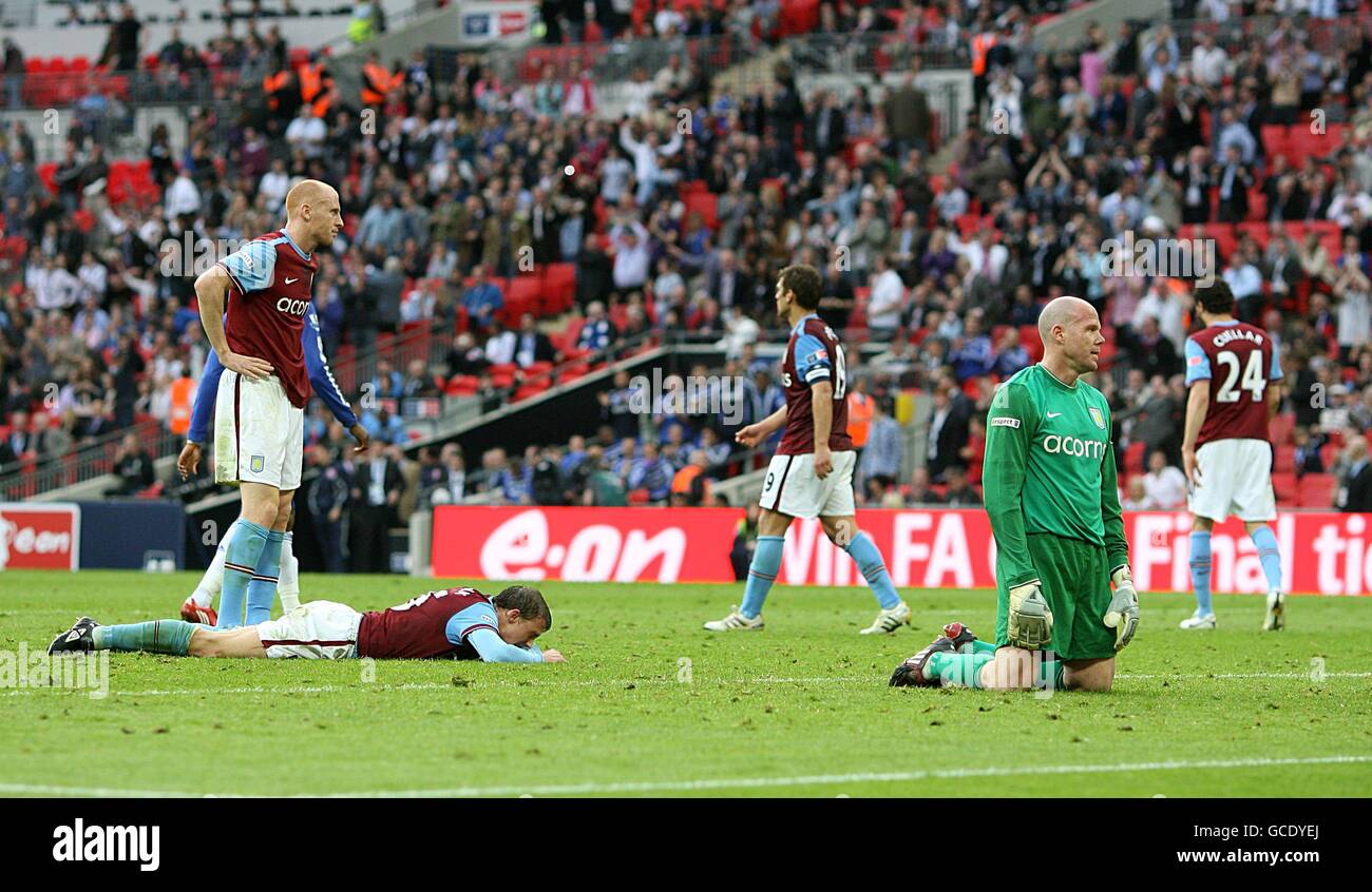 Aston Villa's players appear dejected after Chelsea's third goal Stock ...