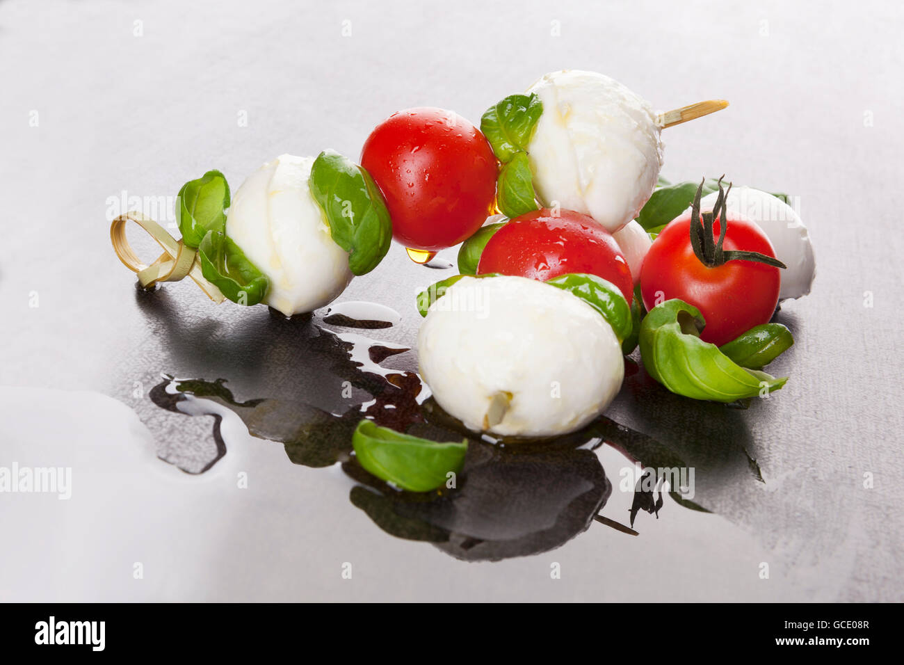 Delicious fresh caprese. Mozzarella cheese, fresh basil and cherry ...