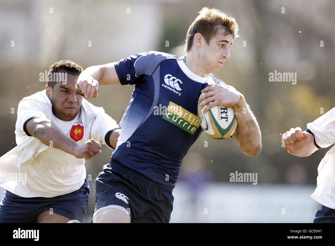Scotland under 19's Michael Donegan (right) is challenged by France ...