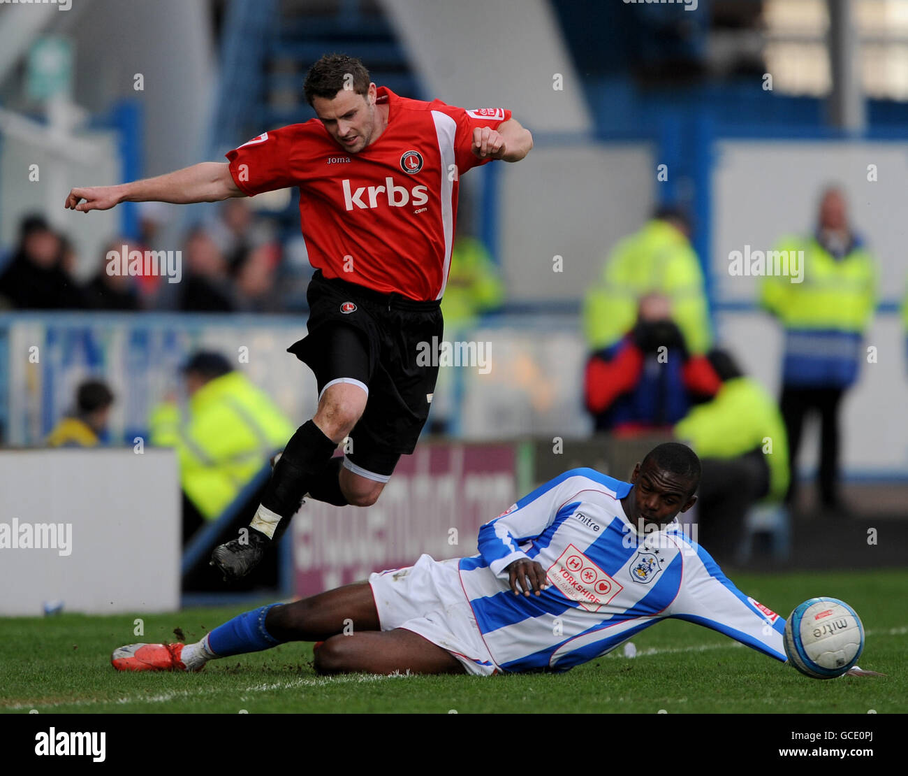 Huddersfield Town's Theo Robinson (right) challenges Charlton Athletic ...