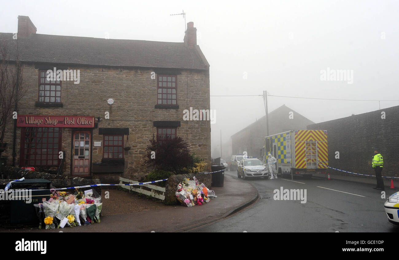 Forensic officers continue to investigate the scene at the post office ...