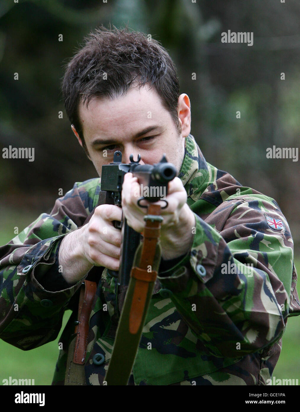 Actor Danny Dyer, uses a Thompson Sub Machine Gun during weapons and ...