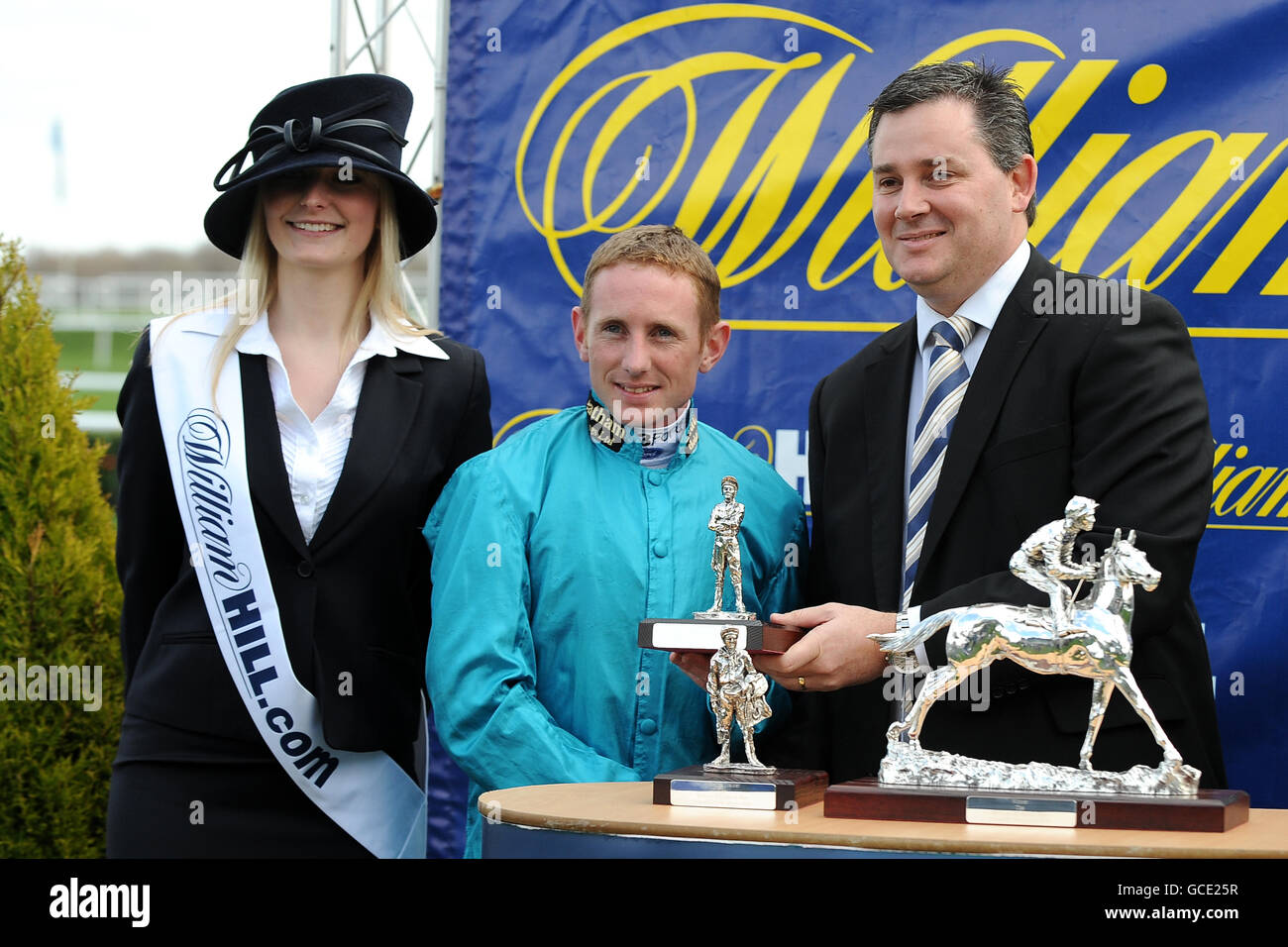 Jockey Paul Hanagan (center) celebrates winning the William Hill Spring ...