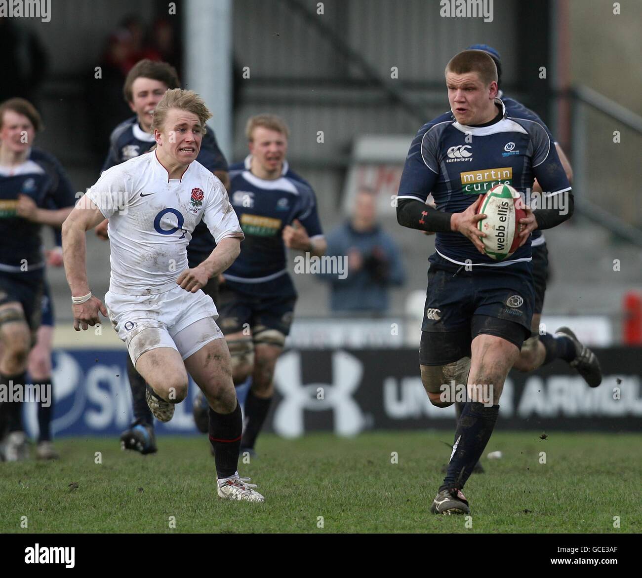 Scotland's George Turner takes on the England defence during the Under ...