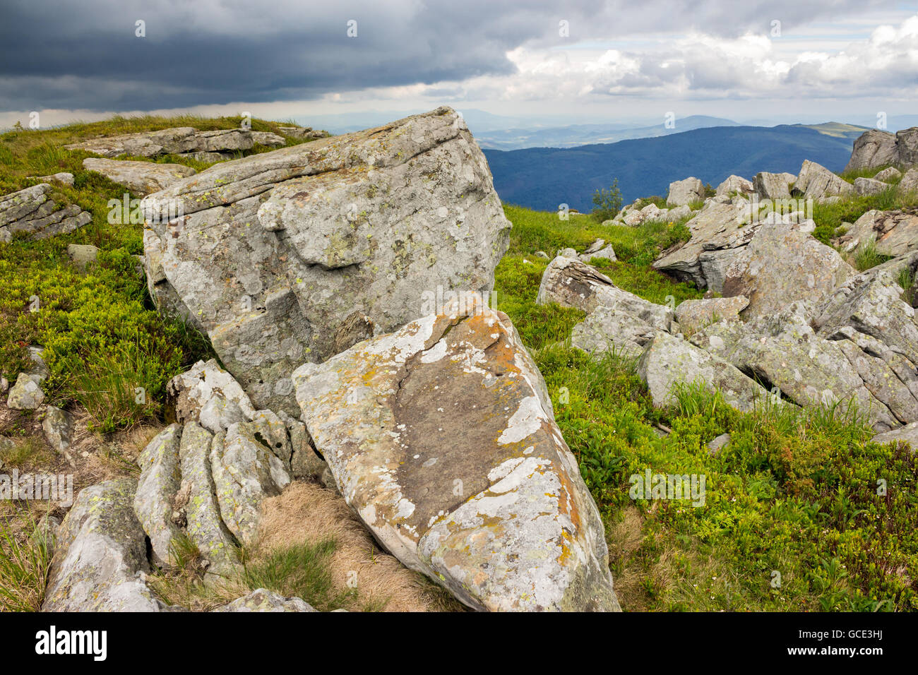 white sharp stones and boulders on the hillside on top of mountain ...