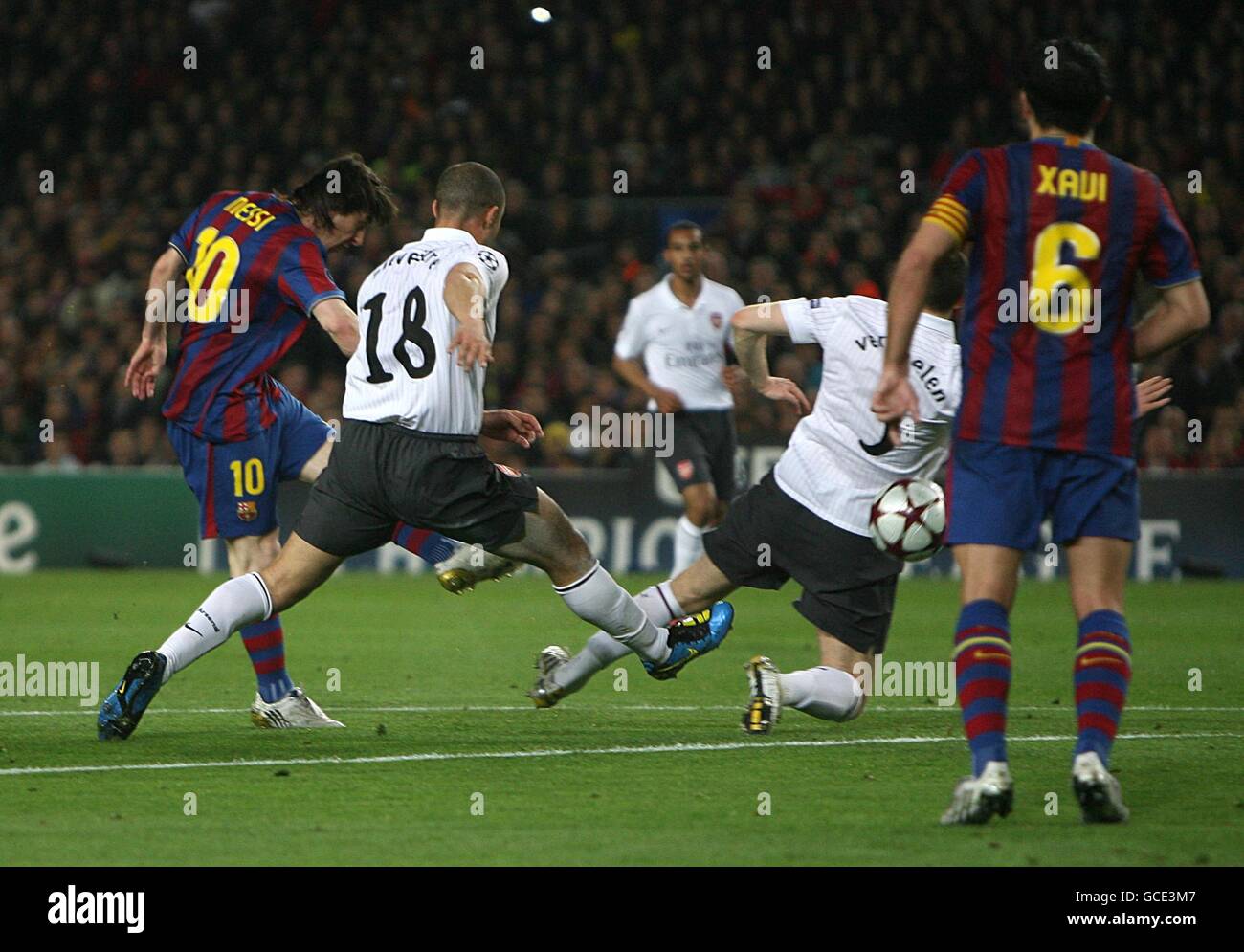 Barcelona's Lionel Messi (left) scores his sides equalising goal Stock ...