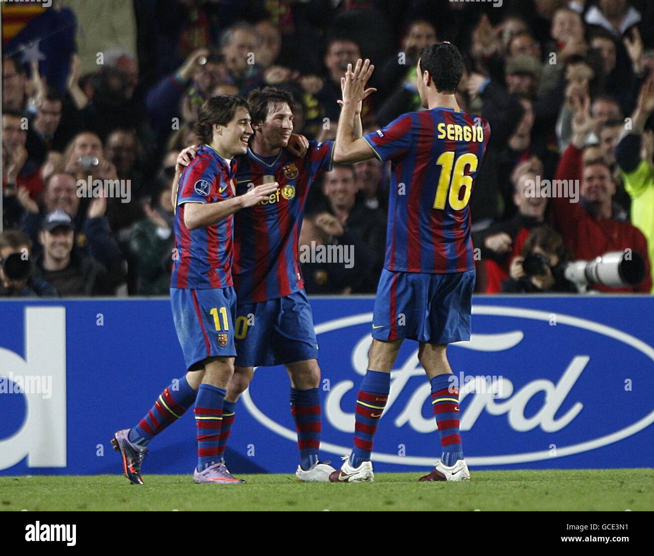Barcelona's Lionel Messi celebrates with team mates Bojan Krkic (left ...
