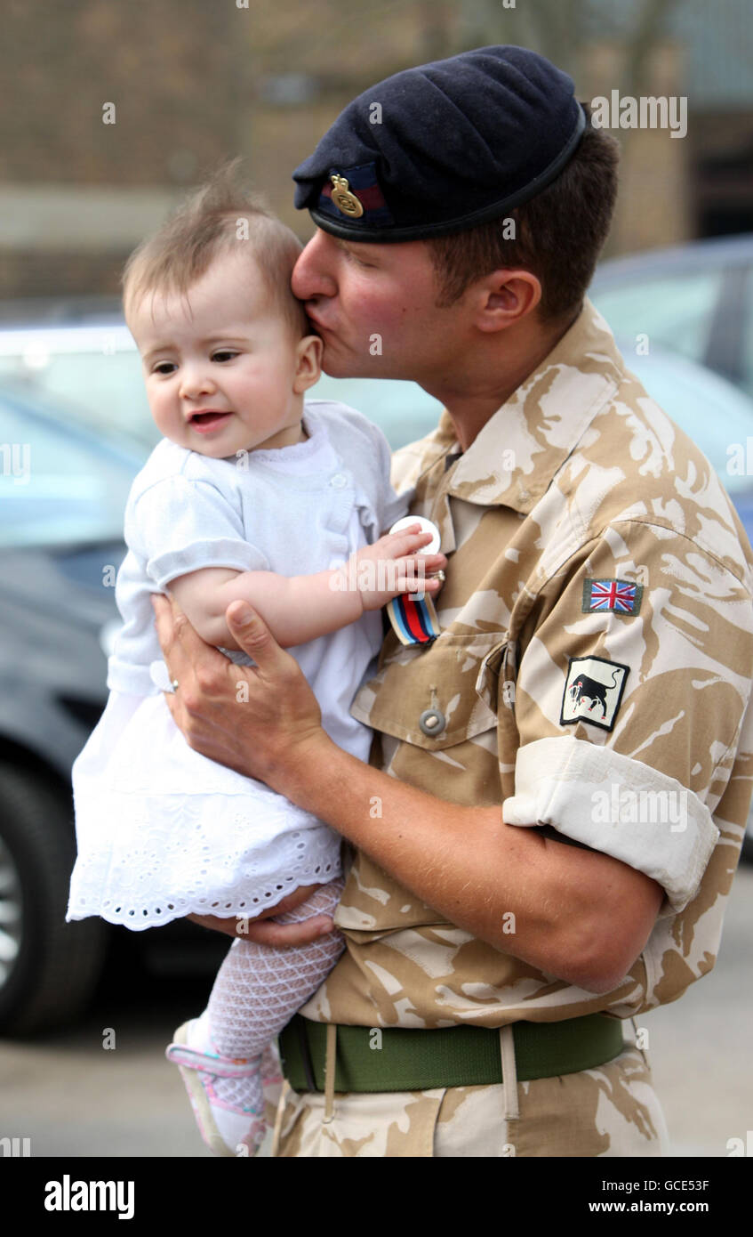Lance Cpl Mark Neal with 8-month-old daughter Jessica Lilly as the C ...