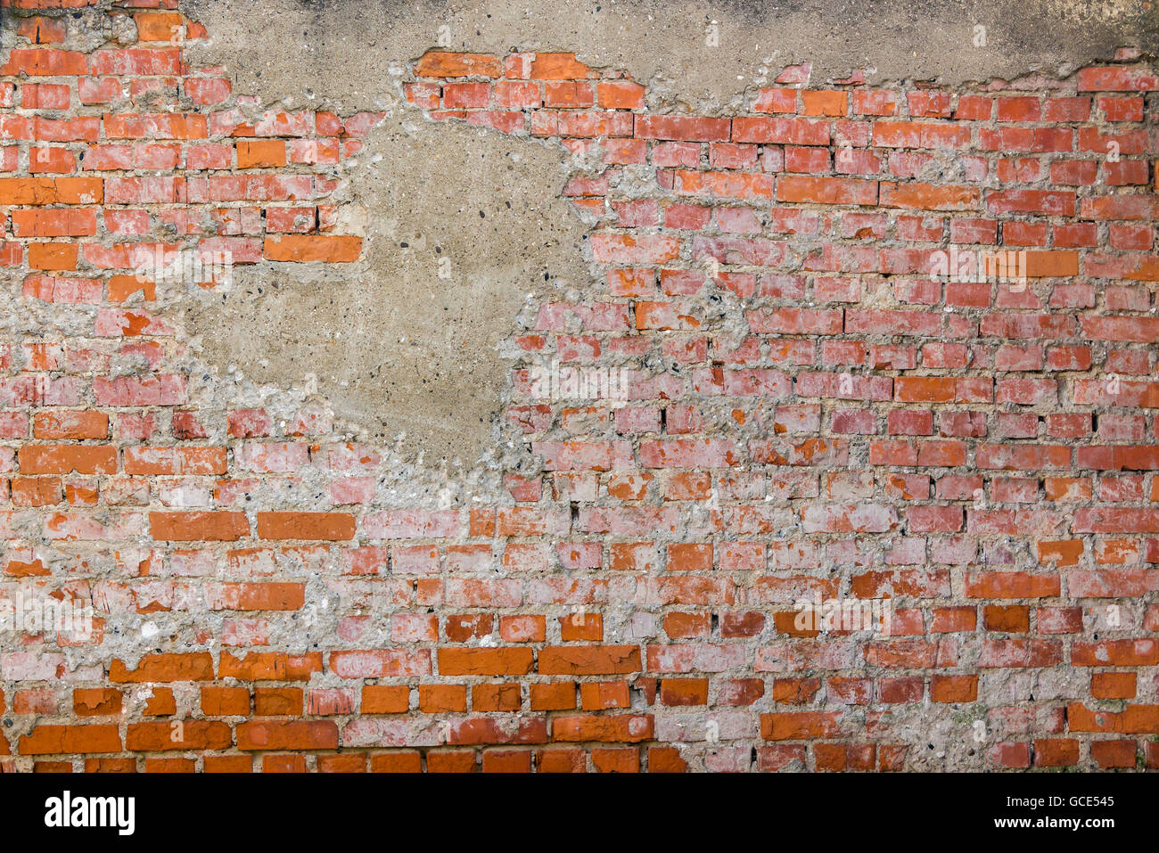 yellow brick wall one brick red Stock Photo - Alamy