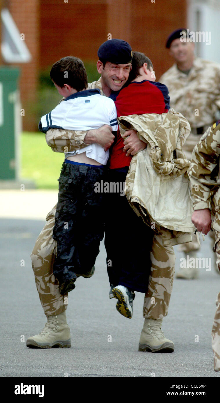 Major Jamie Baxter from Weston-super-Mare is greeted by his sons Isaac ...