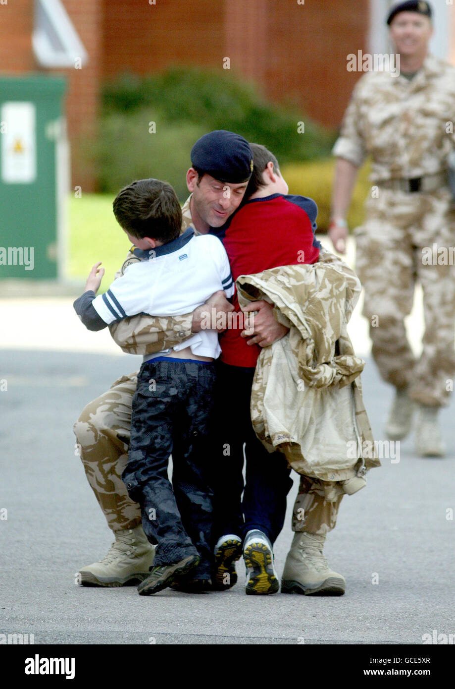 Major Jamie Baxter from Weston-super-Mare is greeted by his sons Isaac ...