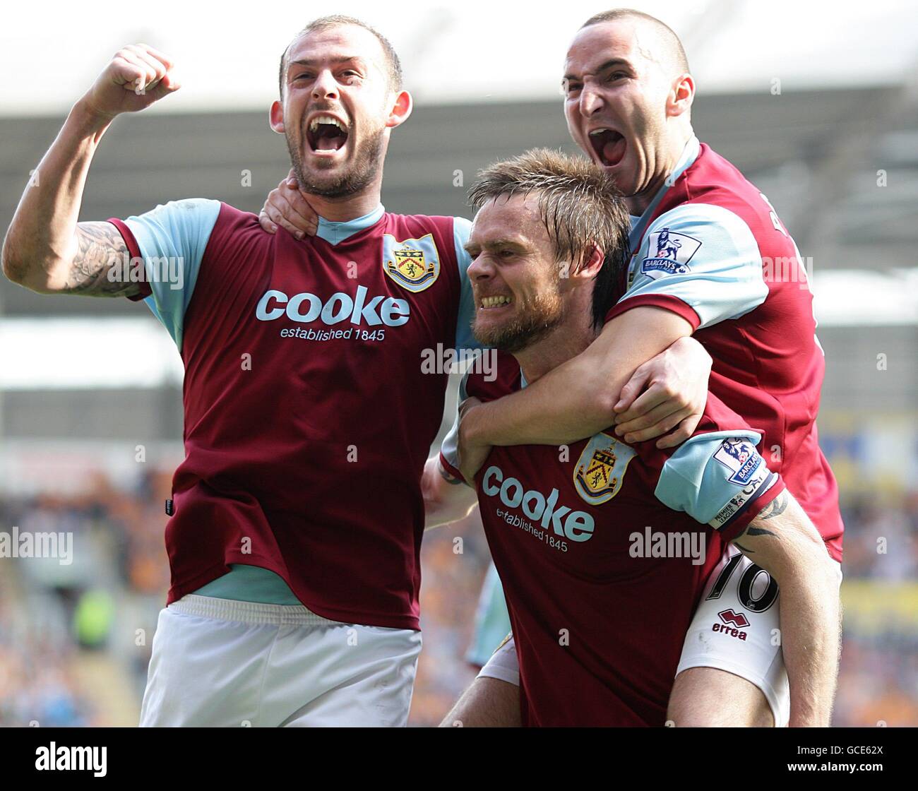 Burnley's Graham Alexander (centre) celebrates scoring his second goal ...