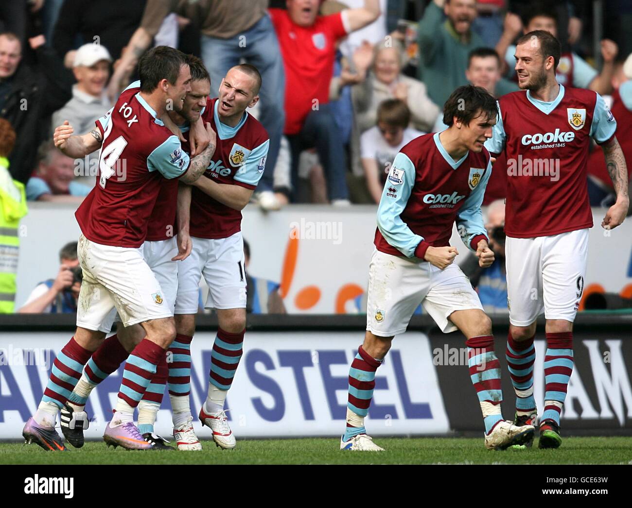 Burnley's Graham Alexander (second from left) celebrates scoring from ...